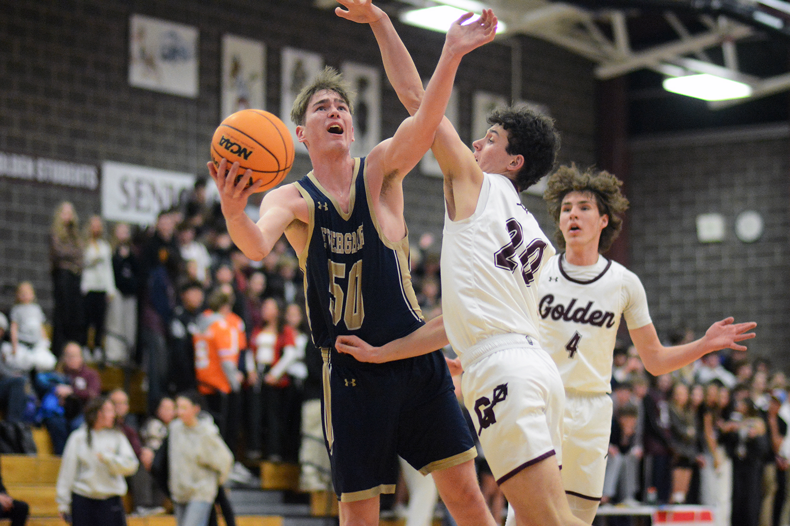 Evergreen boys hoops get signature victory at Golden to end Demons' 10 ...