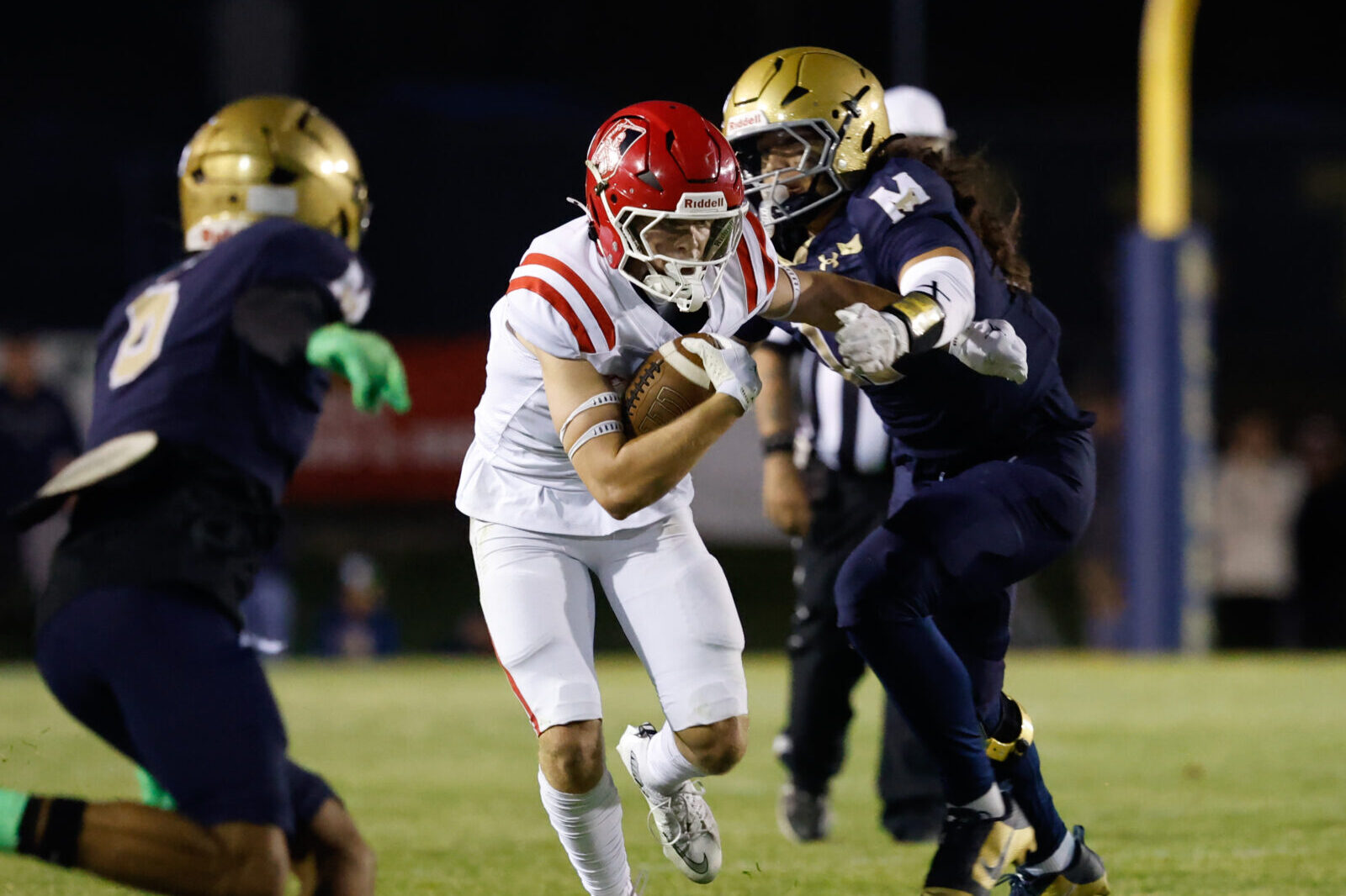 Regis Jesuit football wins close battle with Mullen