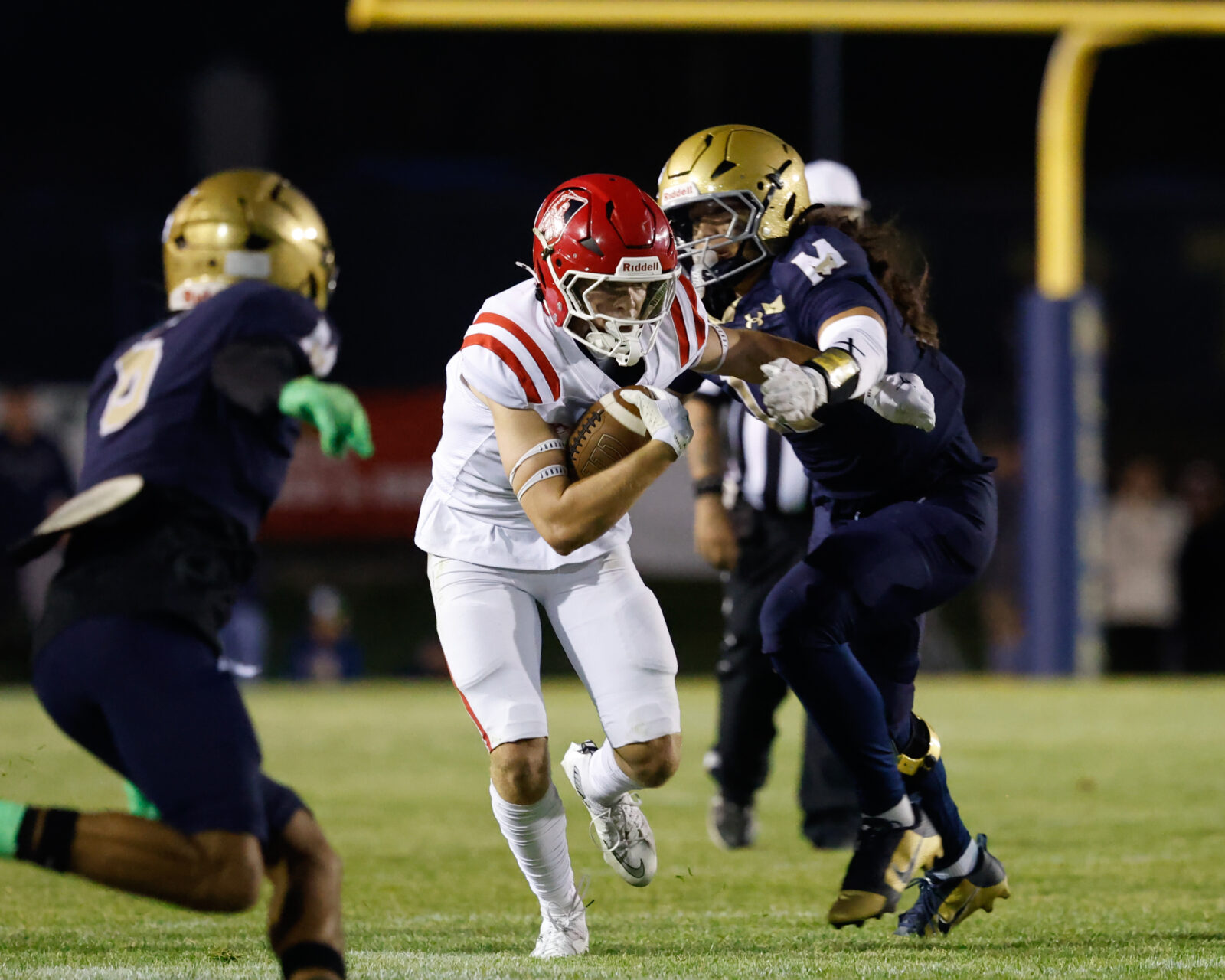 Regis Jesuit football wins close battle with Mullen